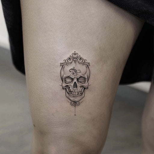 Small skull tattoo with intricate details – IMAGELLA