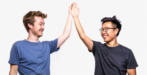 Two men high-fiving on white background, Banksy style – IMAGELLA