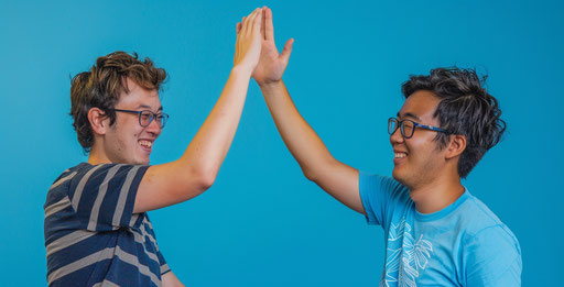 Two men high-fiving in the style of an Asian artist – IMAGELLA